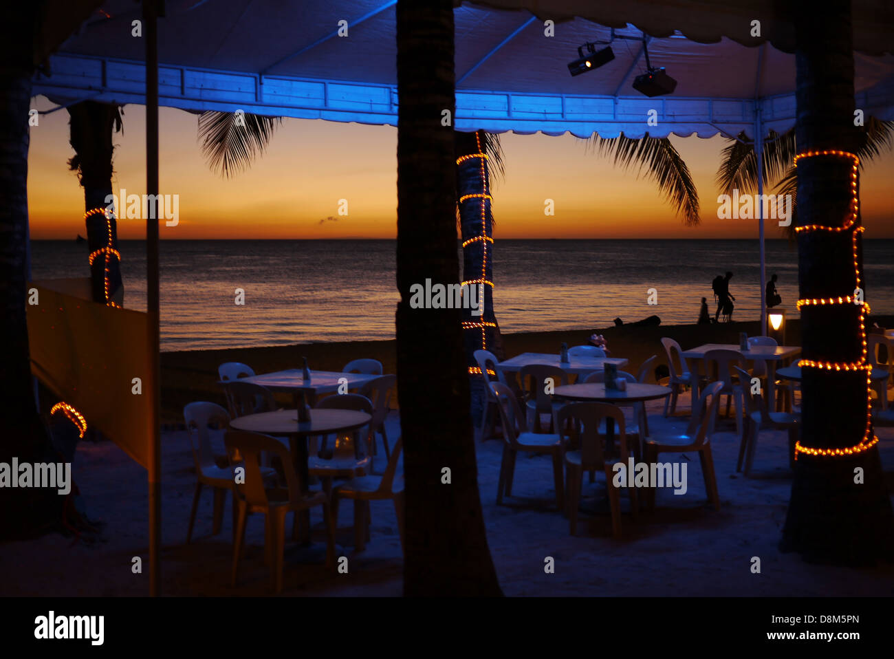Sunset from beach restaurant Stock Photo - Alamy