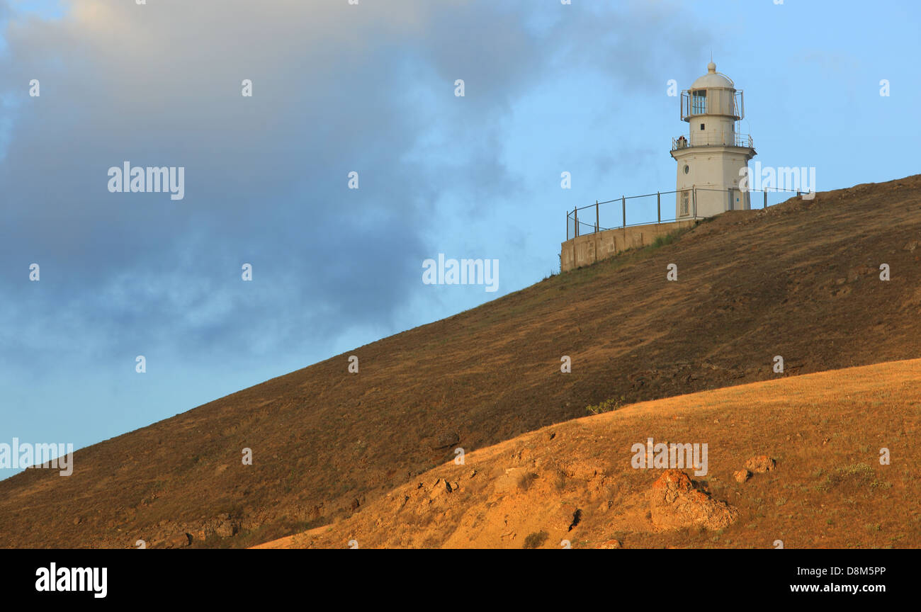 Lighthouse. The movement of clouds on the mountain Meganom, Crimea ...