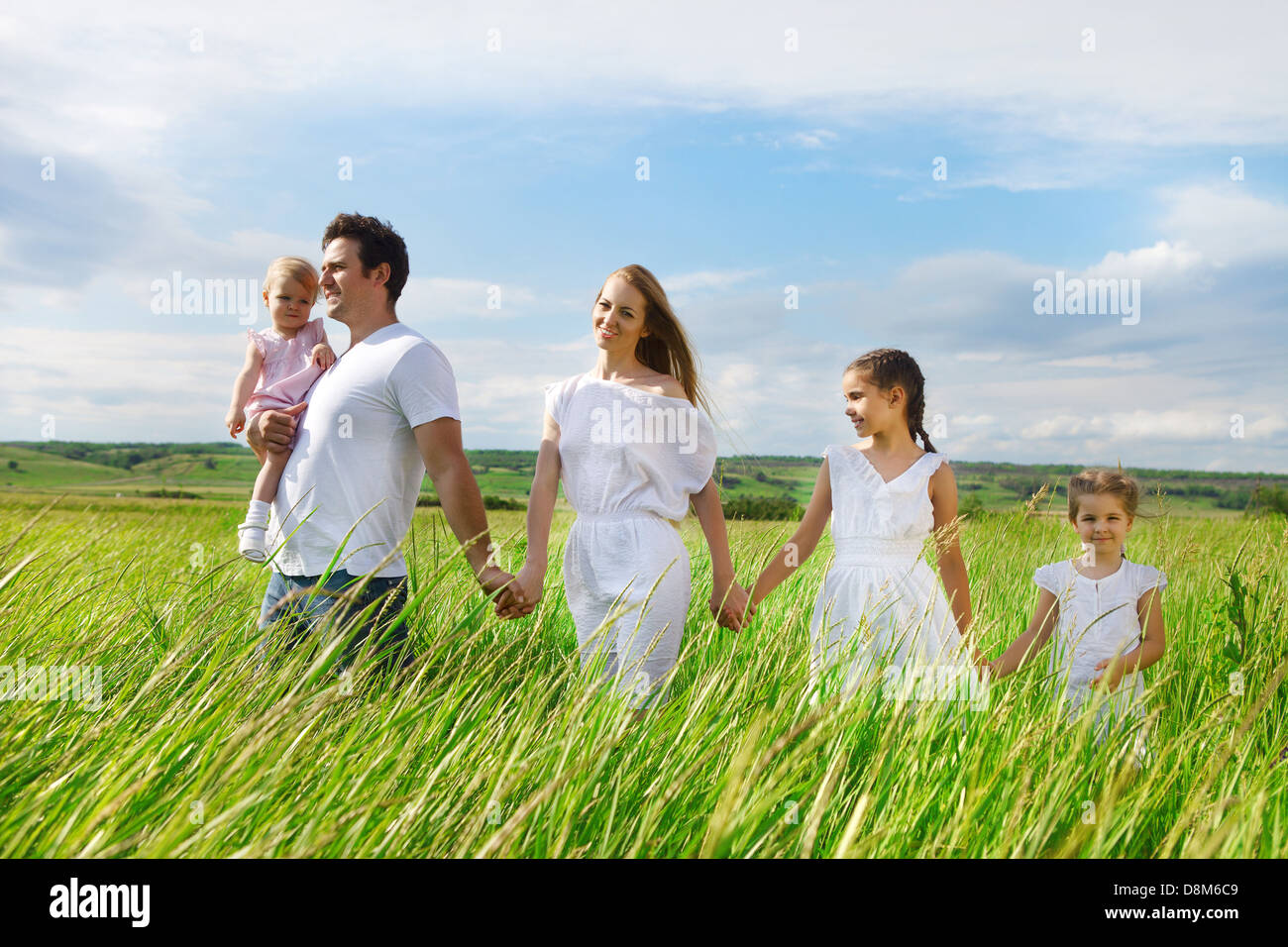 Happy young family with three children Stock Photo - Alamy