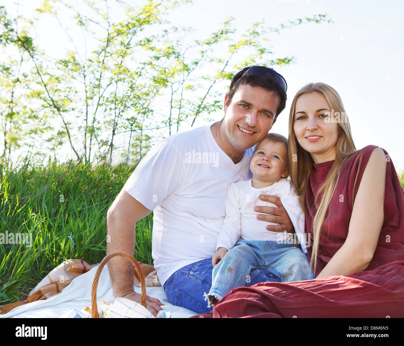 Happy young family Stock Photo - Alamy