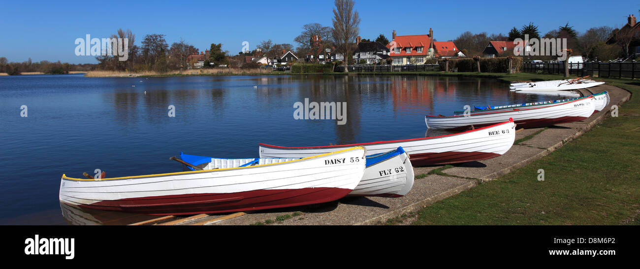 Colourful wooden rowing boats for hire on the Mere lake, Thorpeness ...