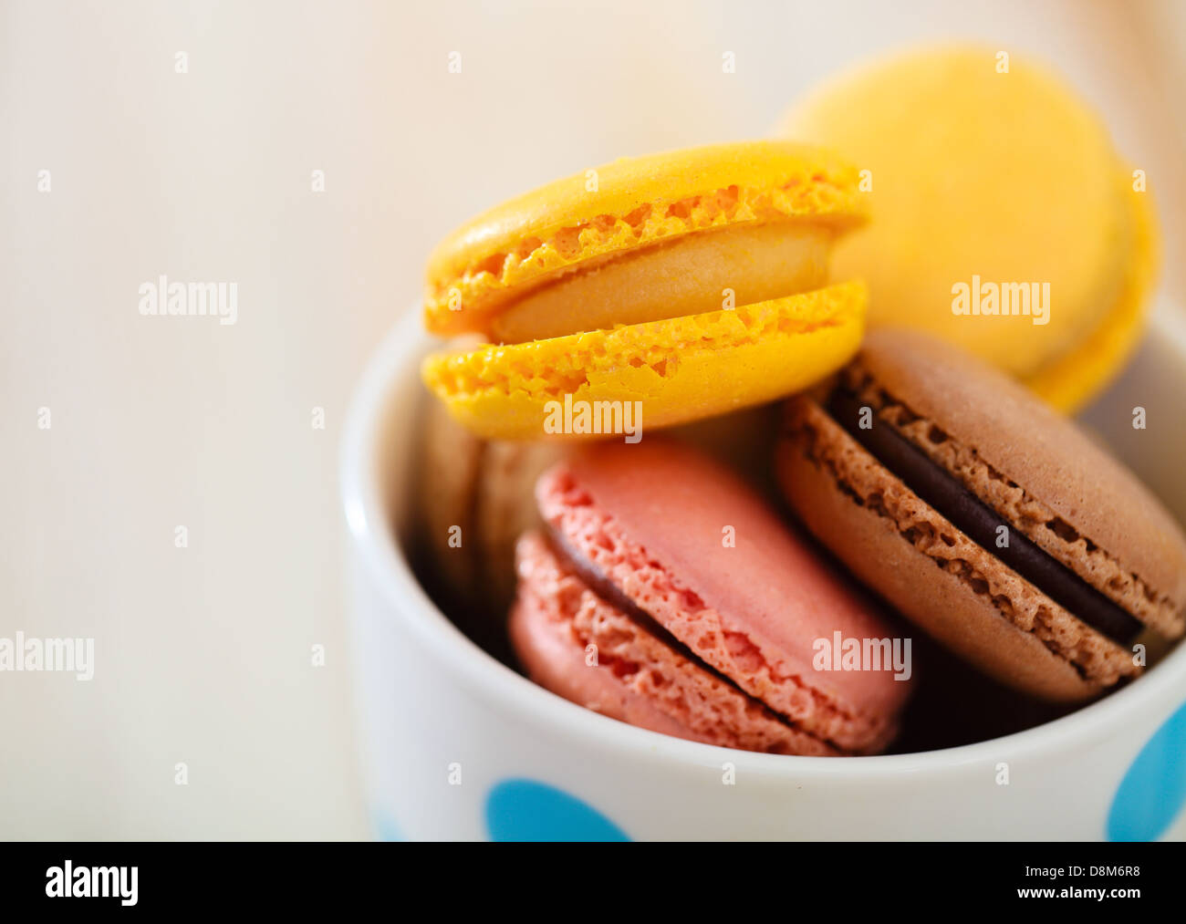 French macaroons in the cup Stock Photo - Alamy