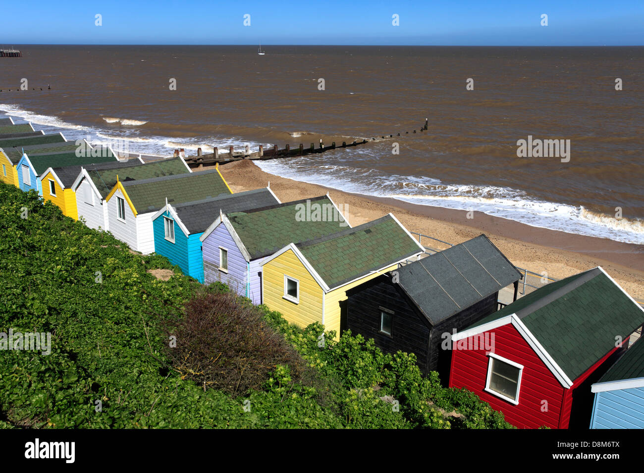 Colourful wooden Beach huts on the promenade, Southwold town, Suffolk ...