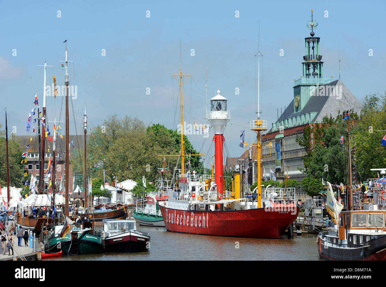 People walk through the port during the Emder Matjes Days at the museum ...
