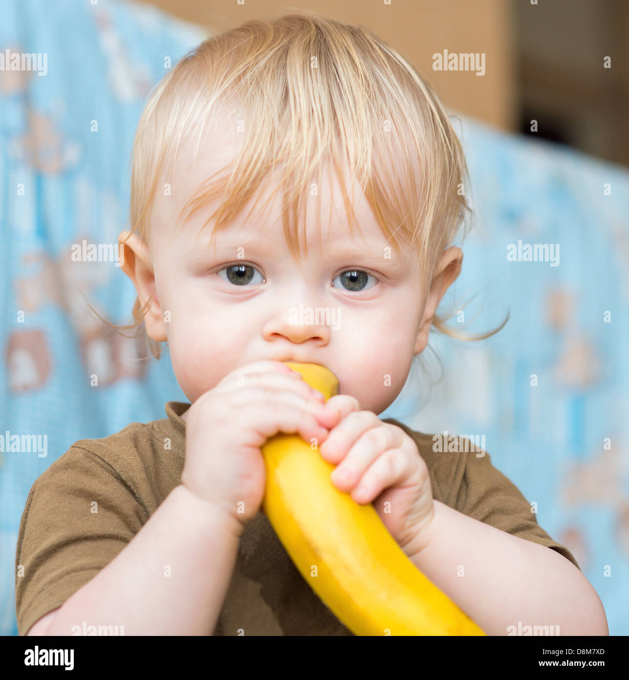 Small boy child eat banana and drink milk. Healthy food and vitamin ...