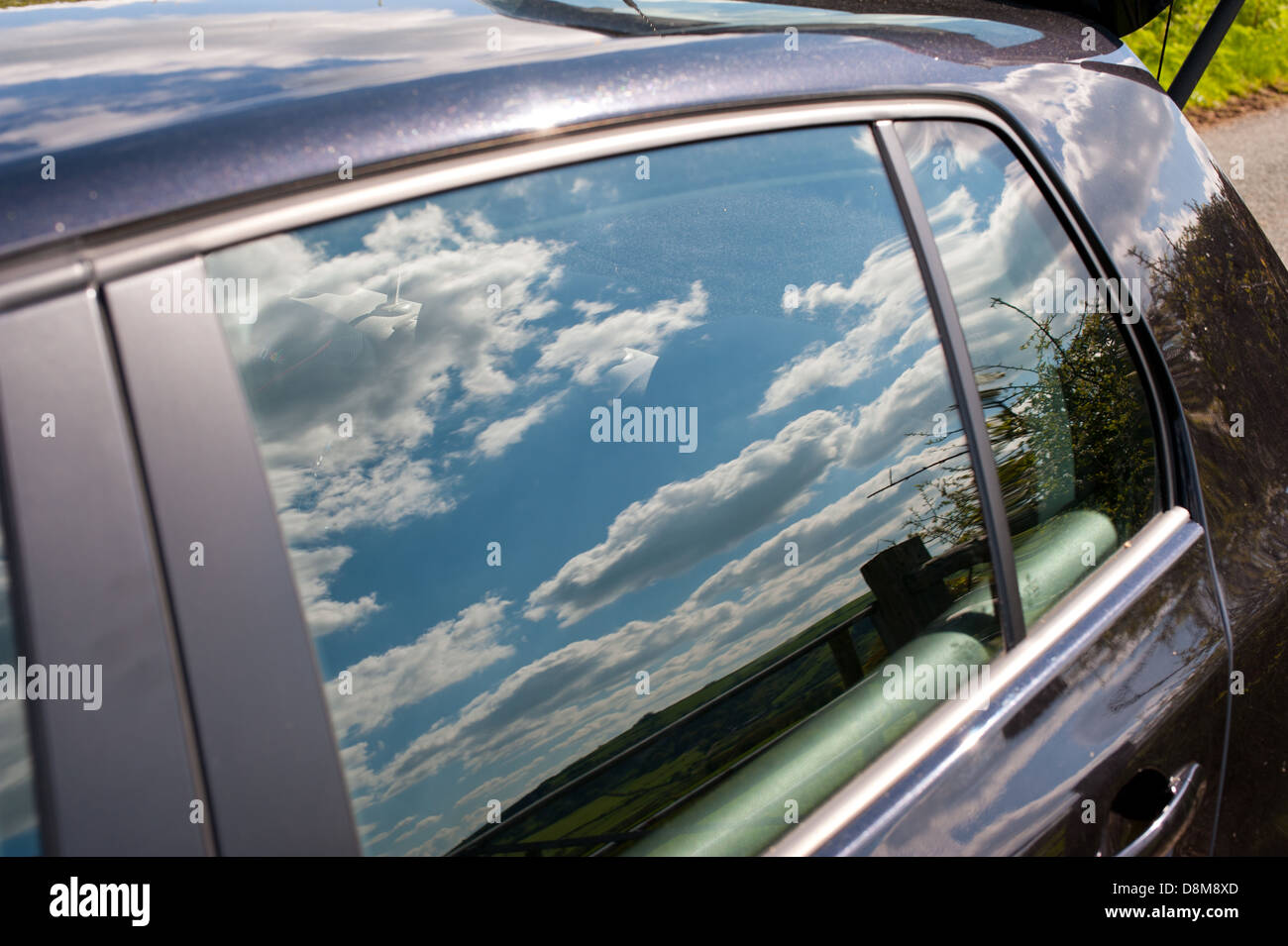 Blue sky and clouds reflected in car window Stock Photo - Alamy