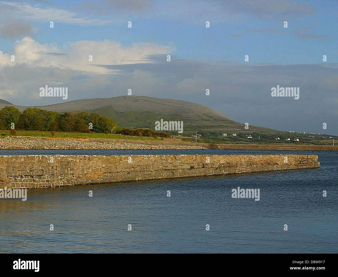 This image captures a beautiful sunset over the Irish landscape. The ...