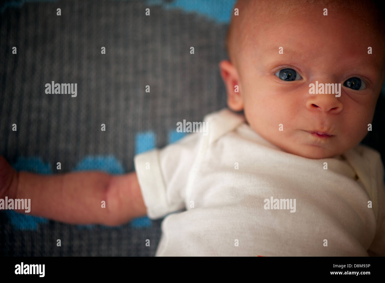 Male infant lying on back Stock Photo - Alamy