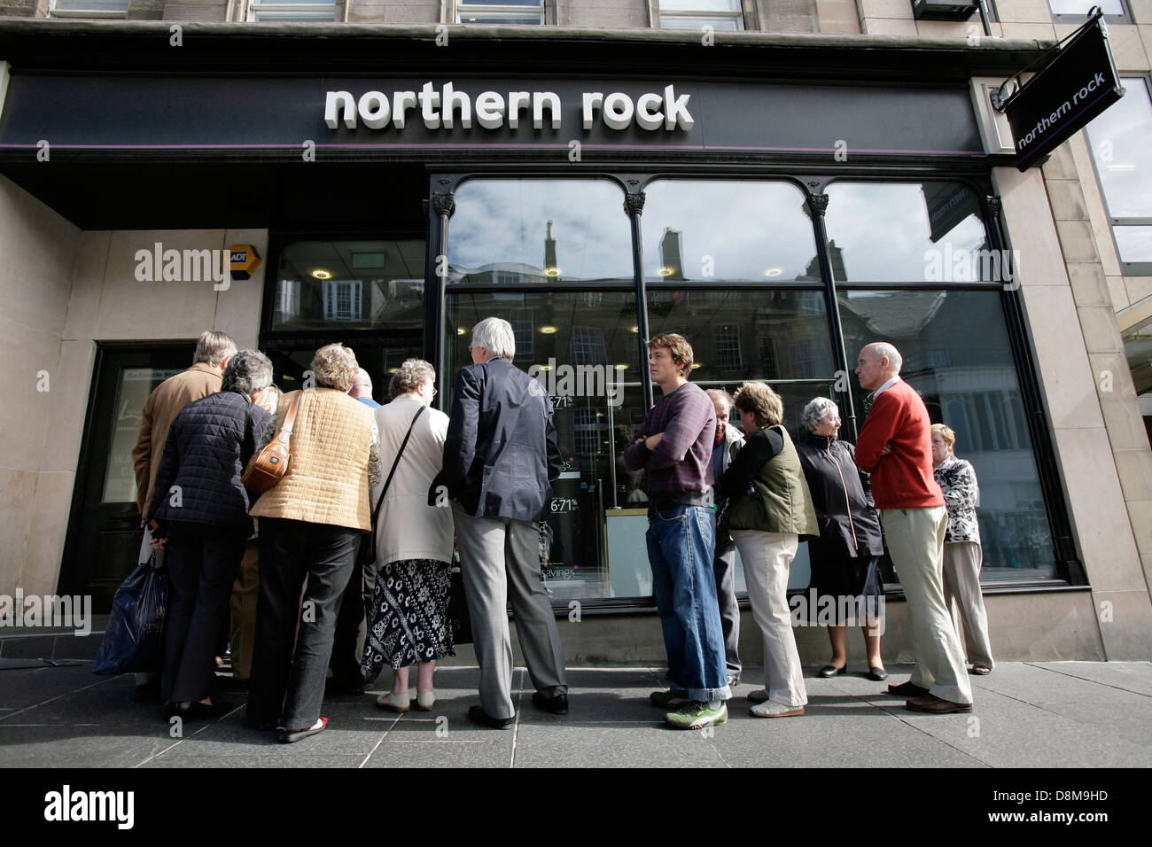 Customers queue at the Northern Rock branch HQ in Edinburgh, following ...