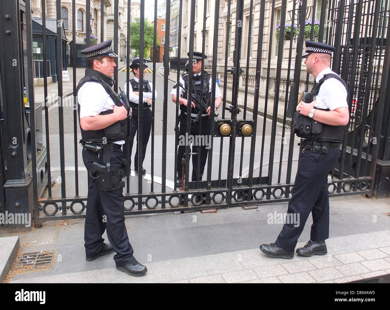 Police men stand at the entry to Downing Street in London, Great ...