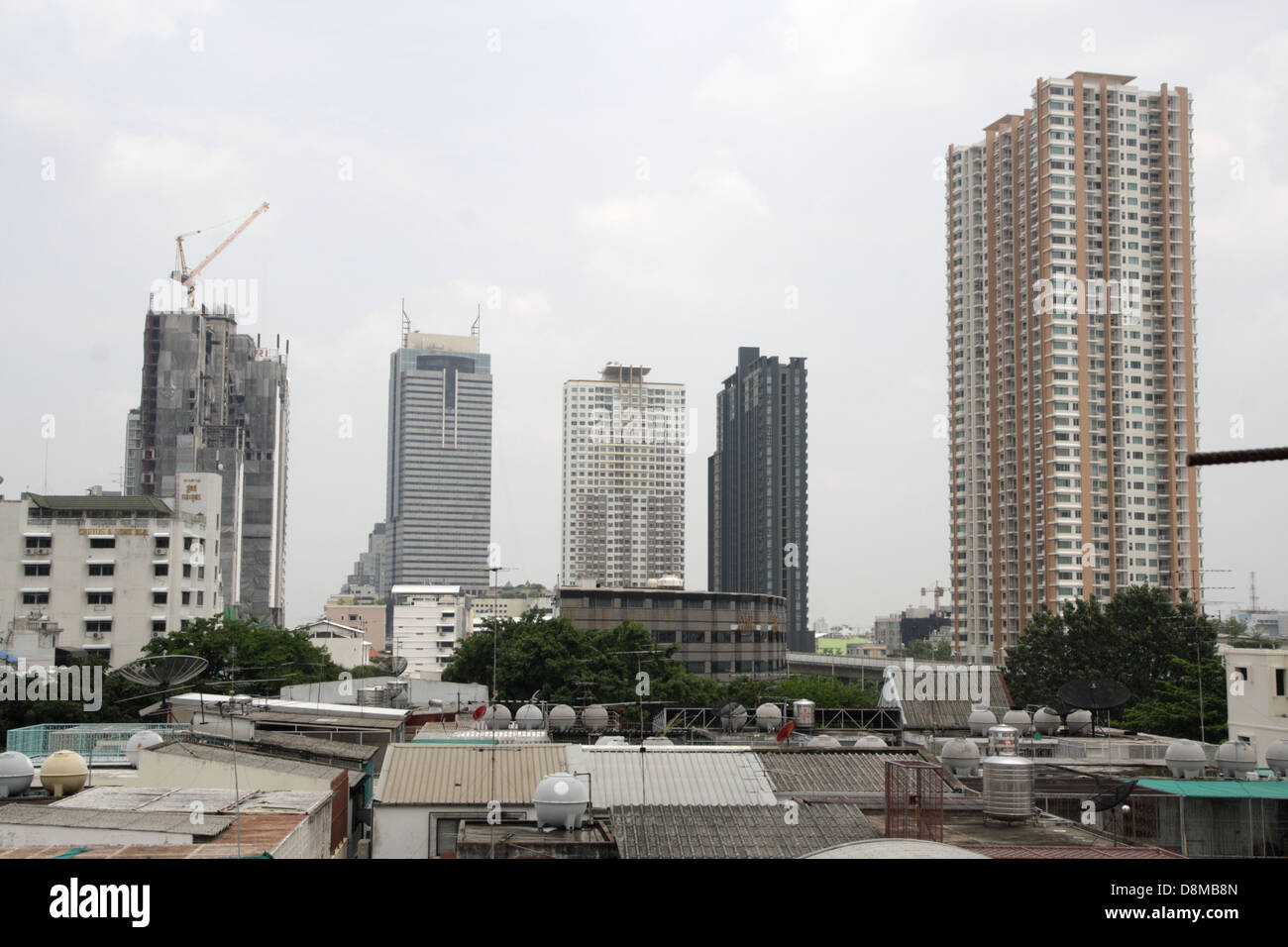 New condominium building along BTS railway in Thonburi area in Bangkok ...