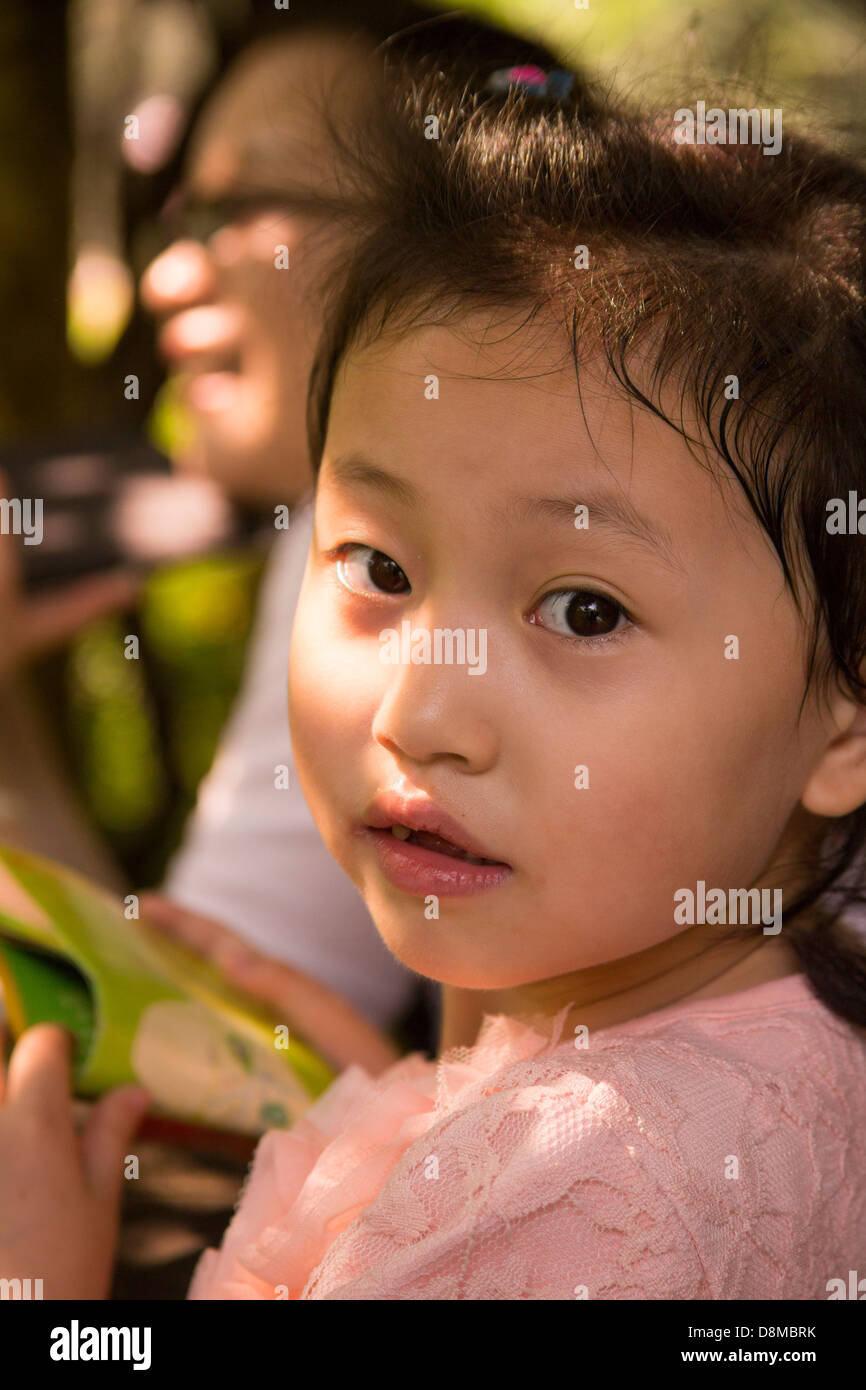 Chinese child enjoying Panda Reserve with her mother Stock Photo - Alamy
