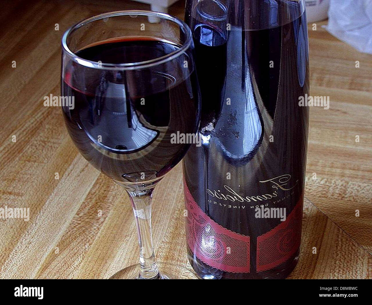 A bottle of port wine labeled 'Framboise', showcasing the rich, deep ...