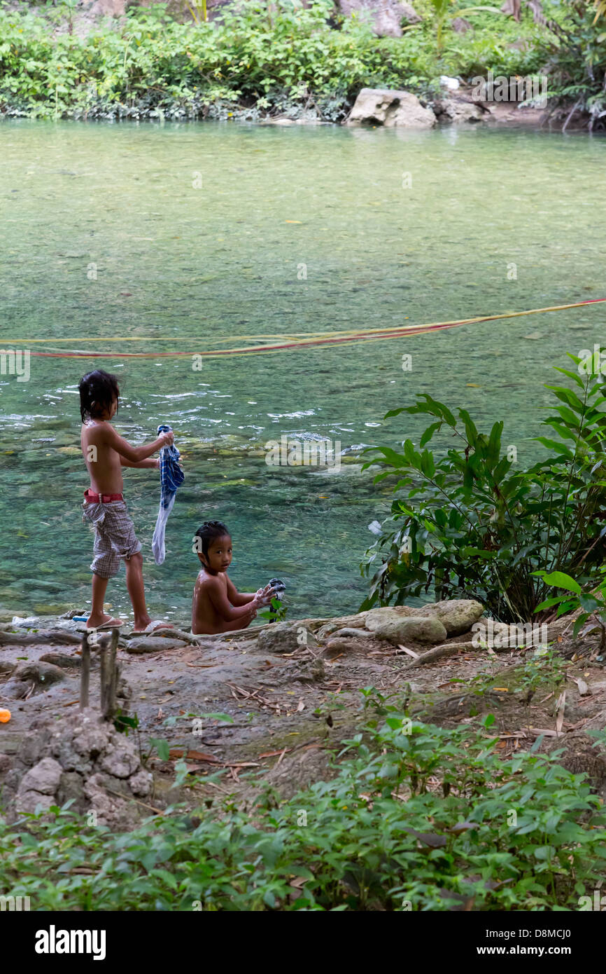 Children washing Laundry in the Creek leading up to the Kawasan ...