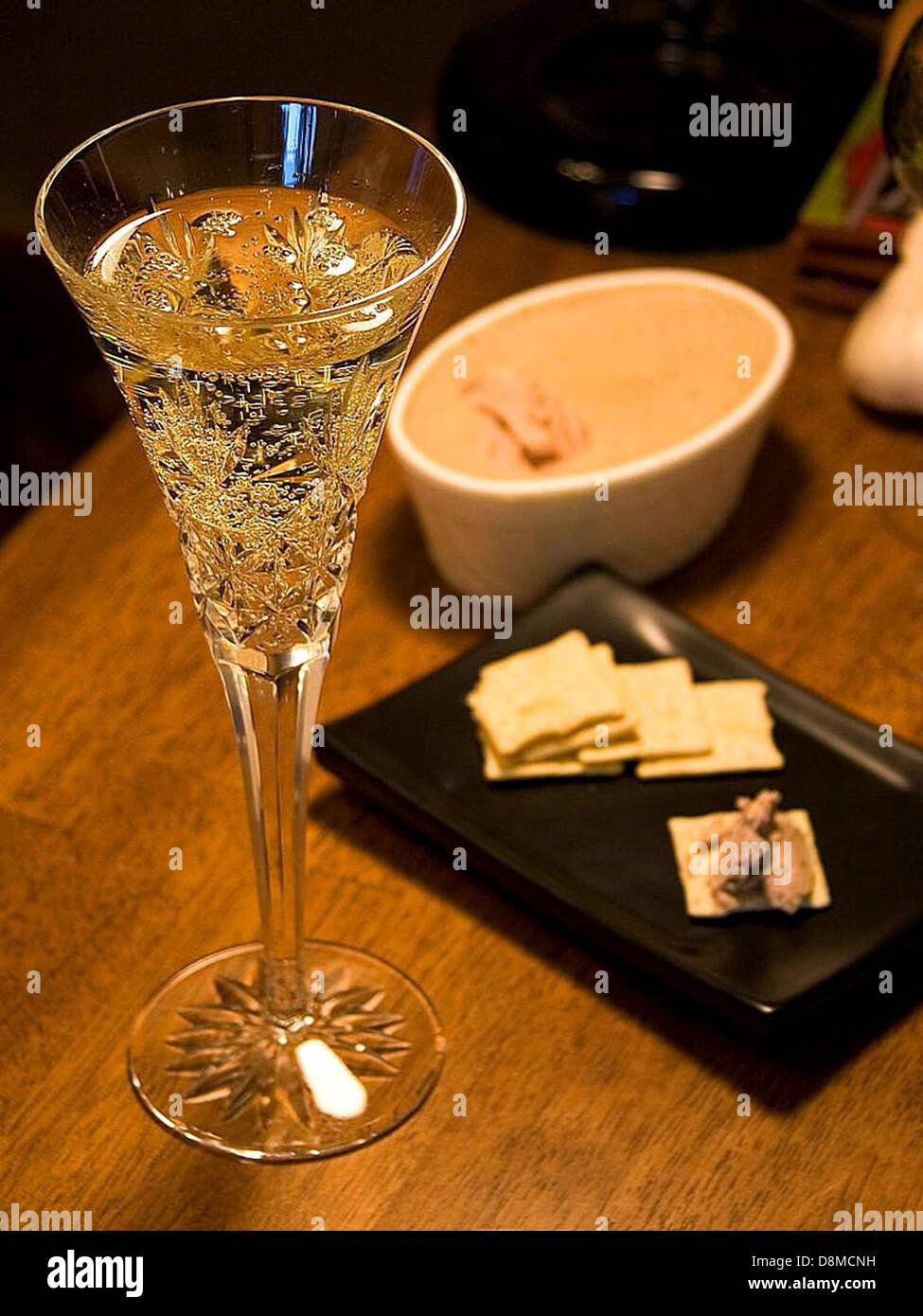Champagne is paired with pâté, a luxurious French dish often enjoyed as ...
