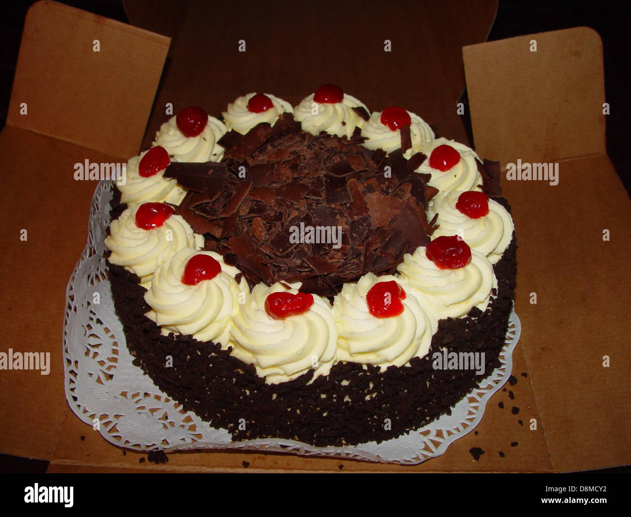 A freshly baked chocolate cake, with rich, smooth layers of chocolate ...