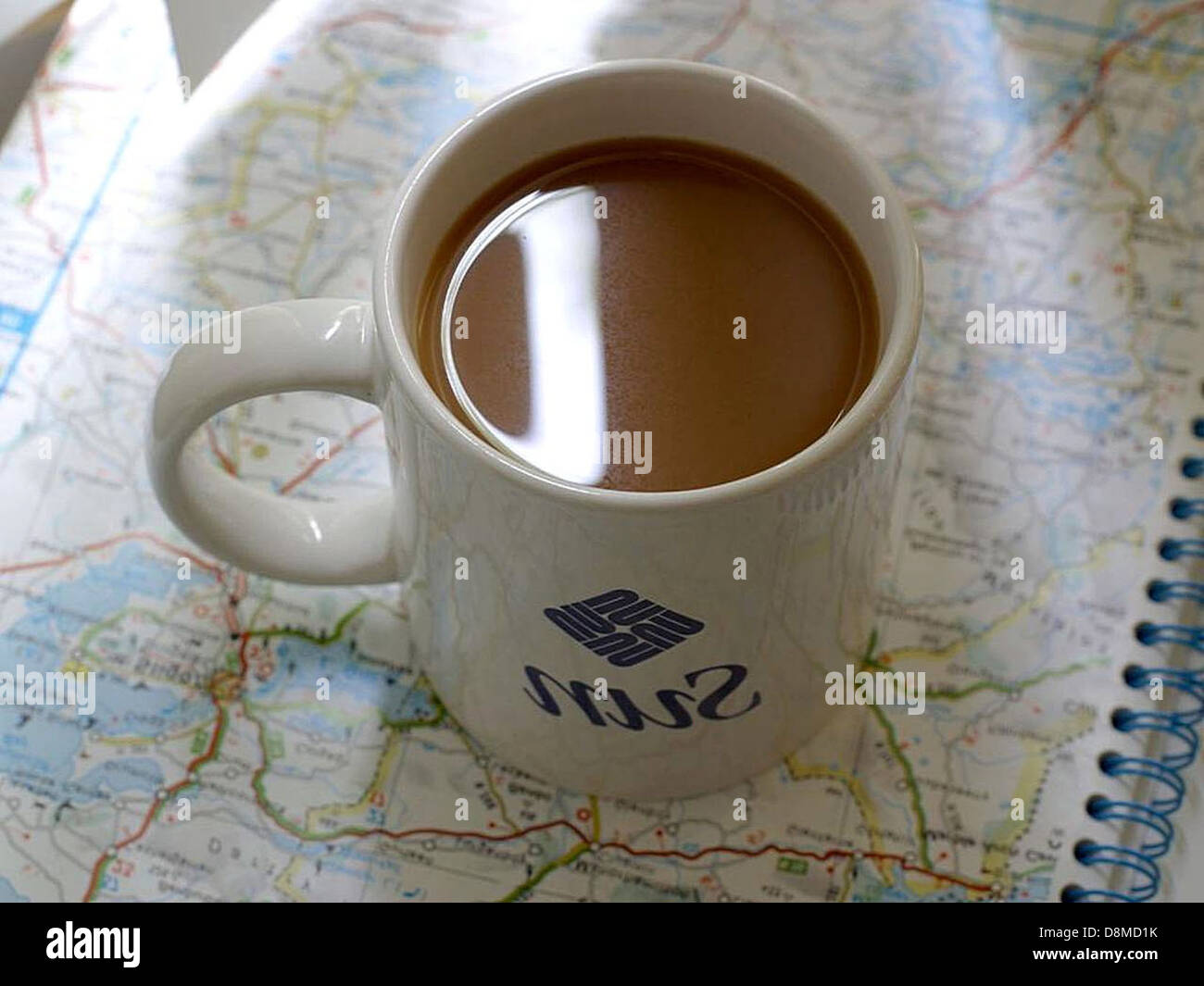 An assortment of coffee mugs and cups arranged together. These ceramic ...