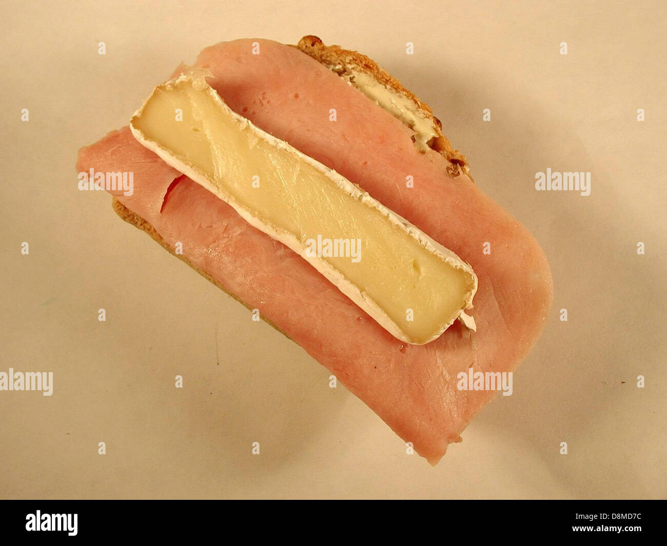 A fast food sandwich featuring layers of meat, cheese, lettuce, and ...