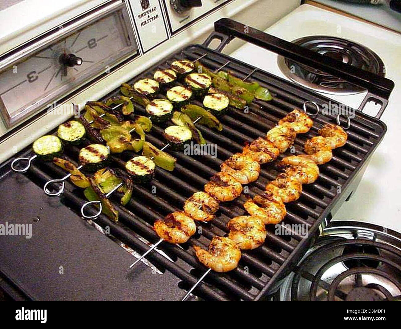 Grilled Cajun shrimp served on a plate, showcasing the well-seasoned ...