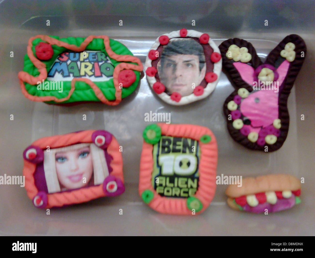 Handmade miniature birthday cakes are carefully crafted for a personal ...