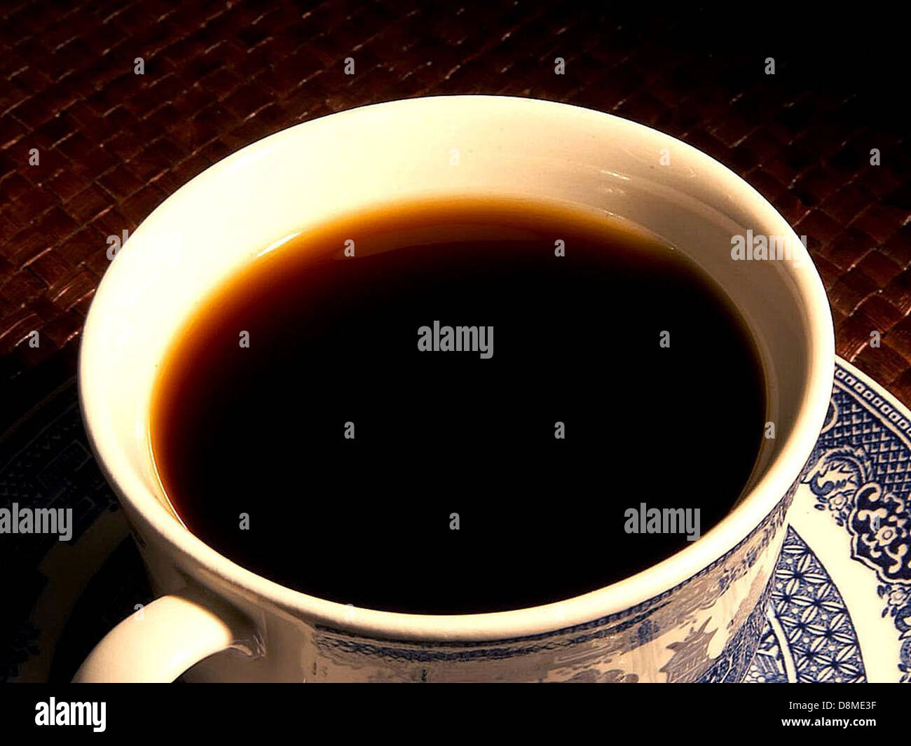 A cup of black coffee without sugar, placed on a table. This simple ...
