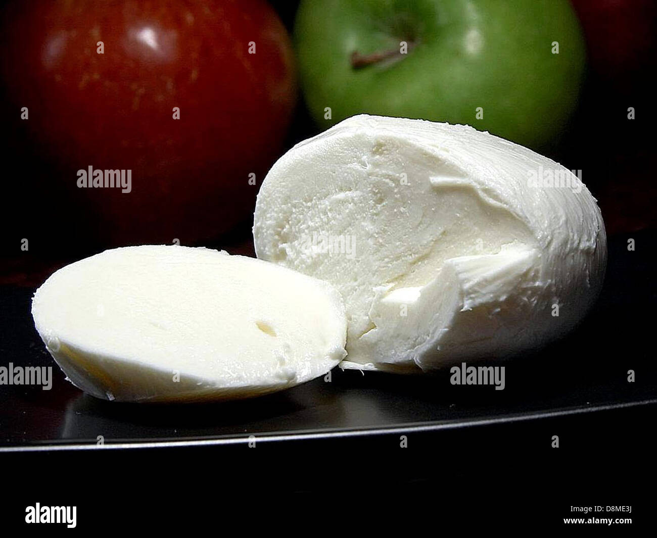 A fresh ball of mozzarella cheese, its soft and creamy texture is ...