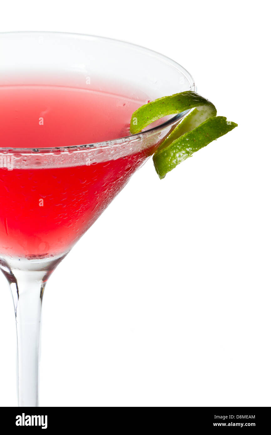 isolated cosmopolitan on a white background garnished with a lime twist ...