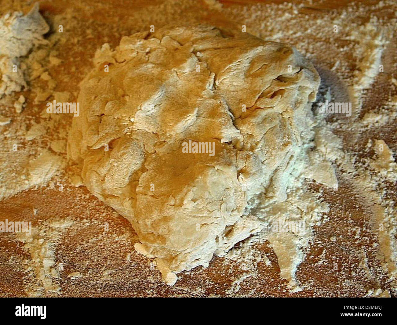 A ball of pizza dough is shown, ready to be stretched and shaped for ...