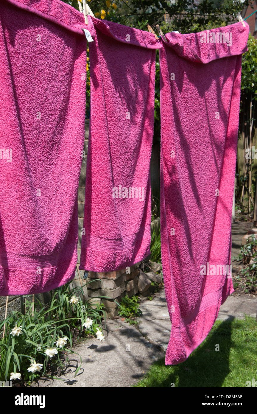 towels drying on washing line, coloued towels, sunny, still, no breeze ...