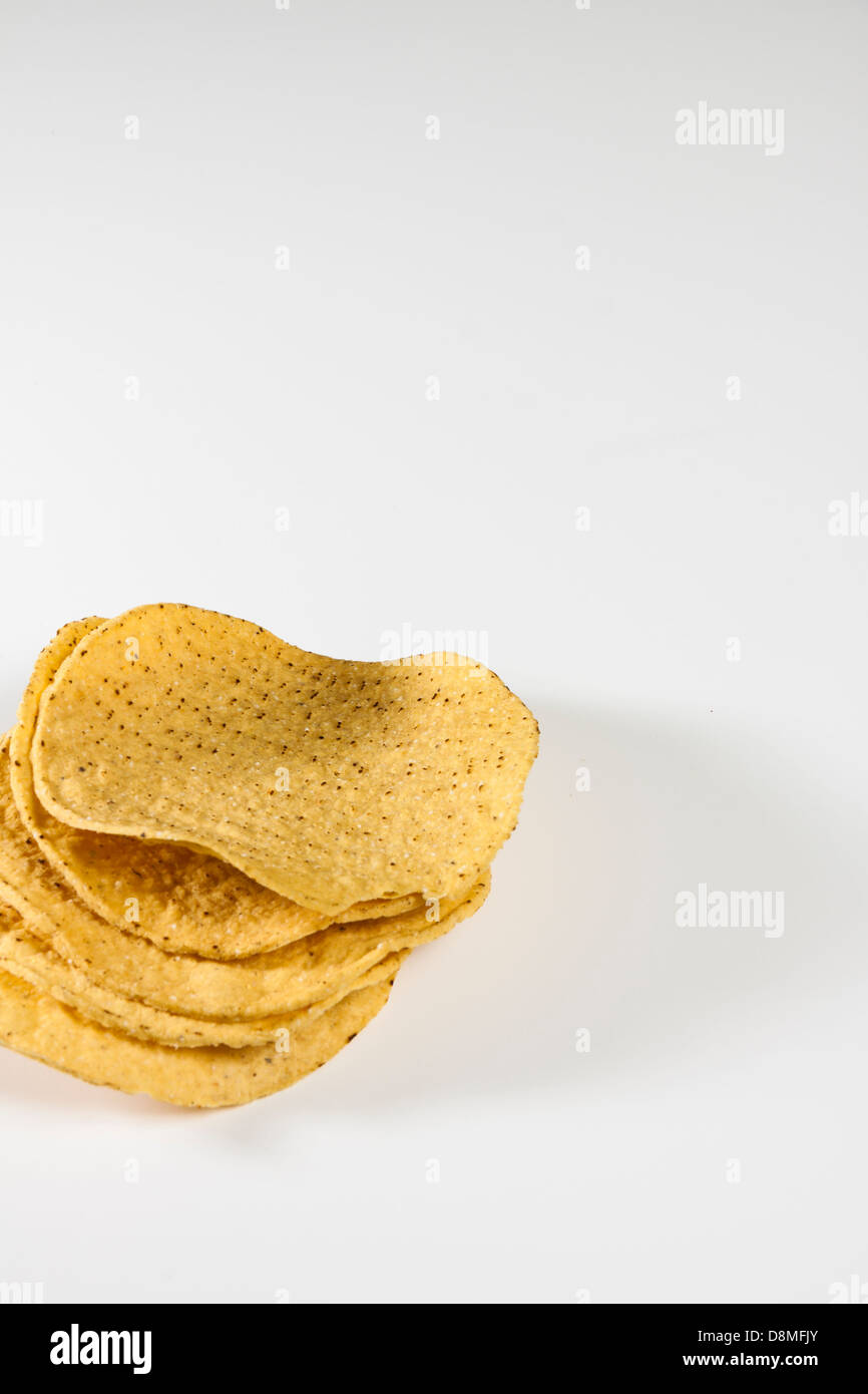 Stack of round tortilla chips isolated on white background, vertical ...