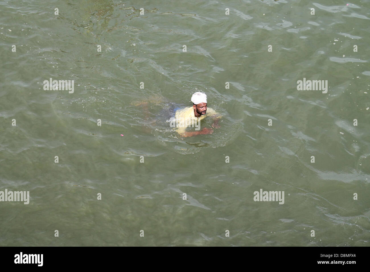 A fisherman swimming in the sea Stock Photo - Alamy