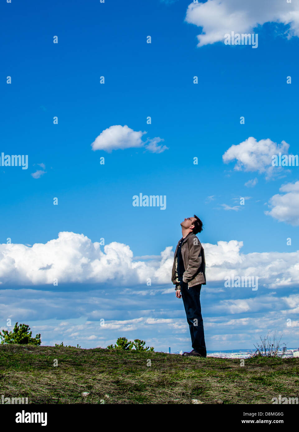 Single Man Stands Outdoor On Hill And Looks Into The Sky Stock Photo ...