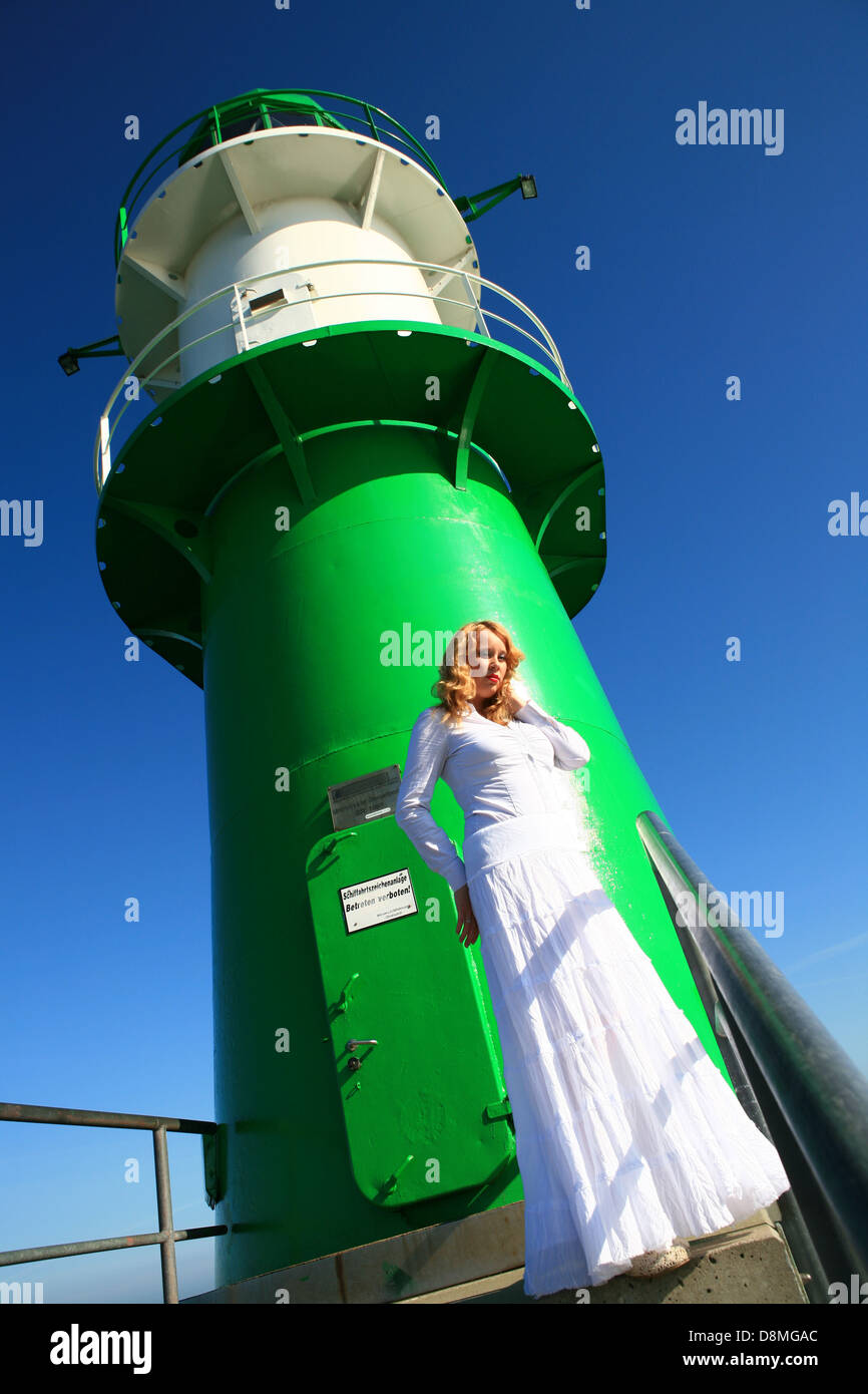 redheaded woman in front of a lighthouse Stock Photo - Alamy