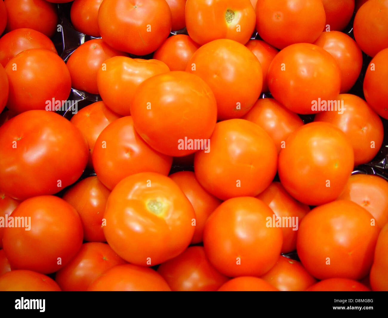 This image features ripe tomatoes, a common vegetable used in culinary ...
