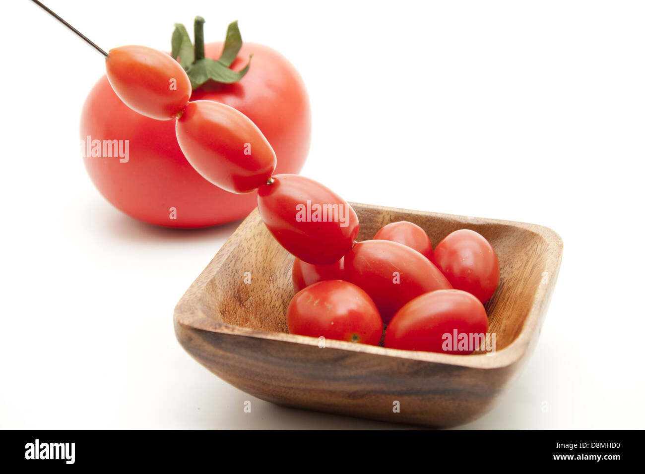 Tomatoes at the spit Stock Photo - Alamy