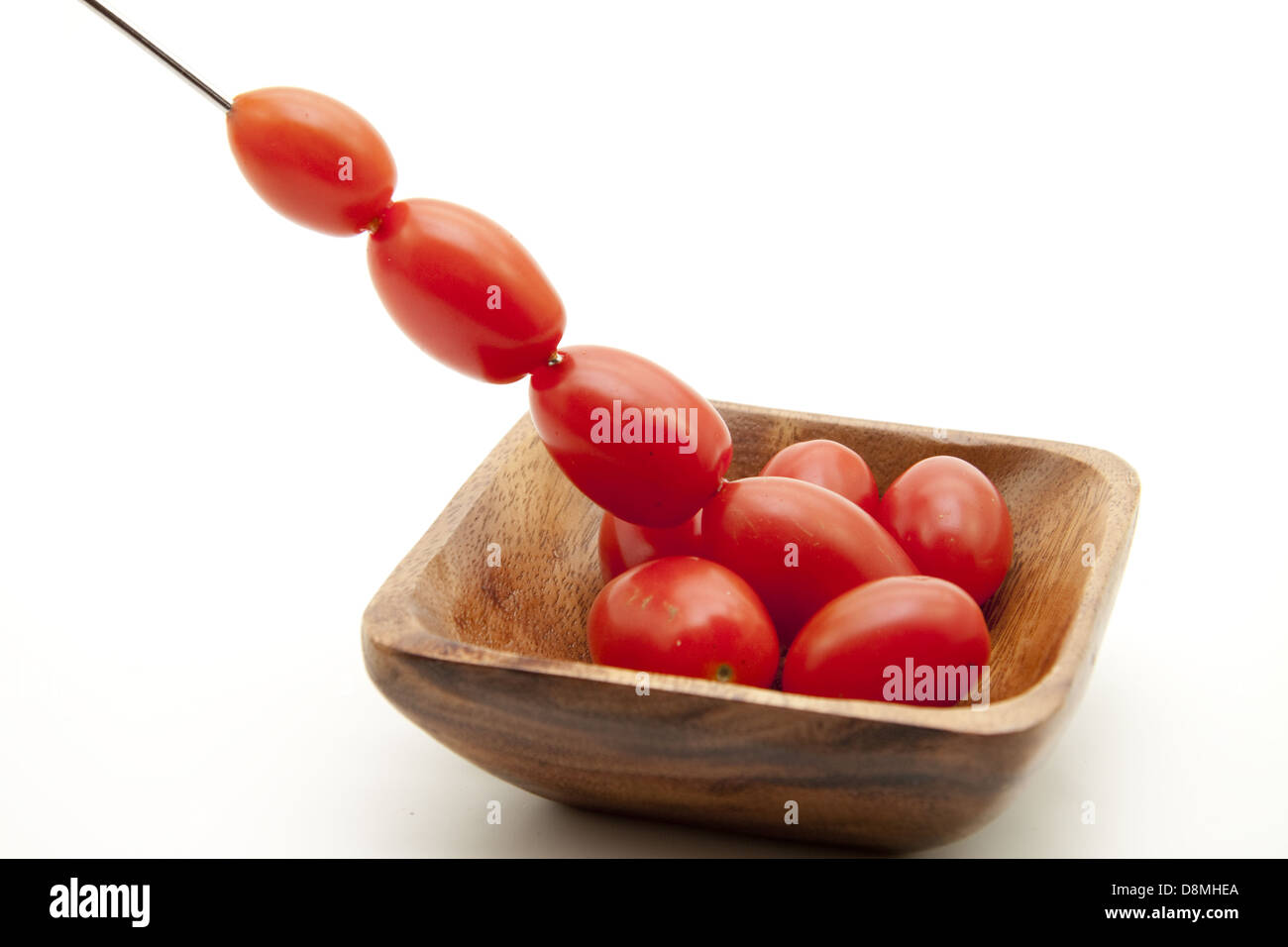 Tomatoes at the spit Stock Photo - Alamy
