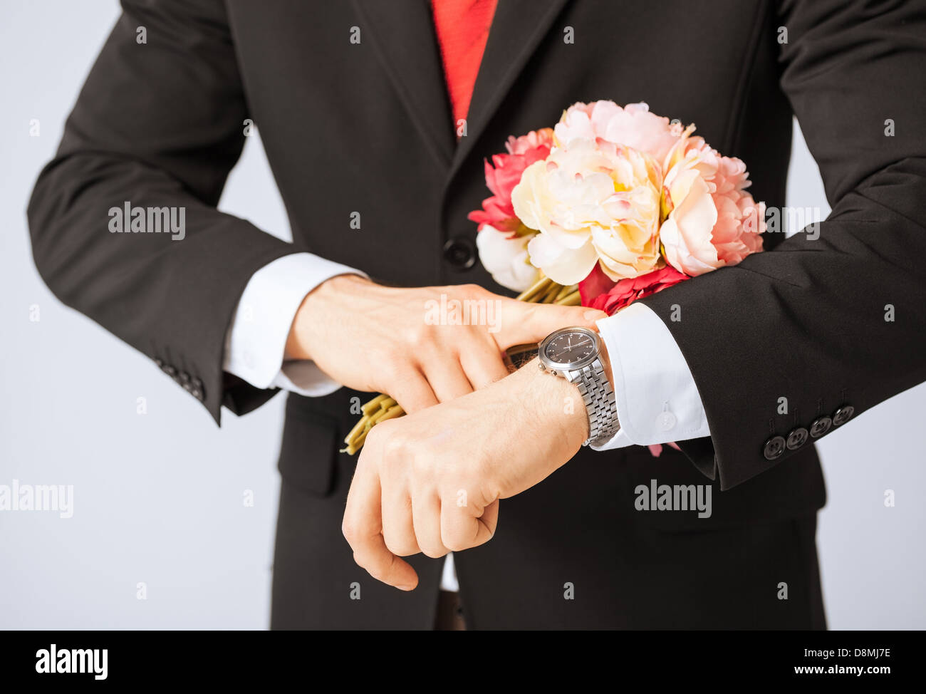 man giving bouquet of flowers Stock Photo - Alamy