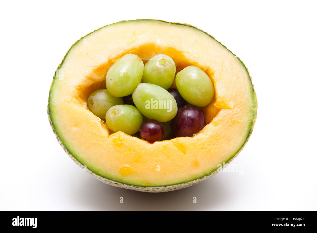 Melon with grapes Stock Photo - Alamy