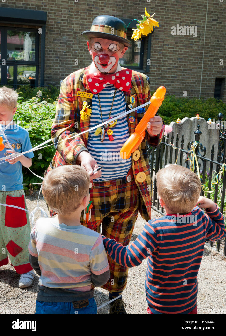 London, England UK. 31st May 2013. Mattie the clown entertains some ...