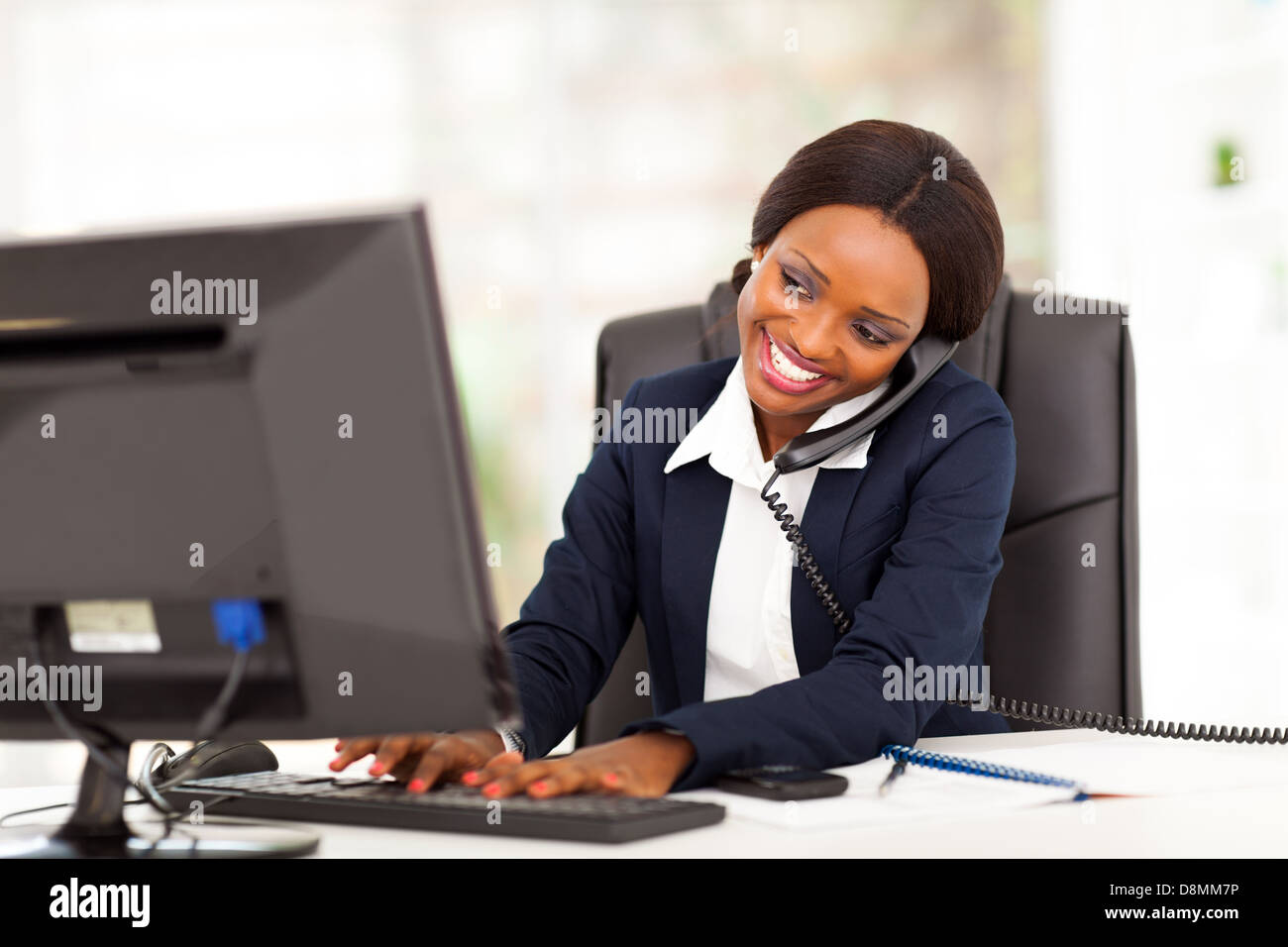 beautiful young African American businesswoman working in office Stock ...