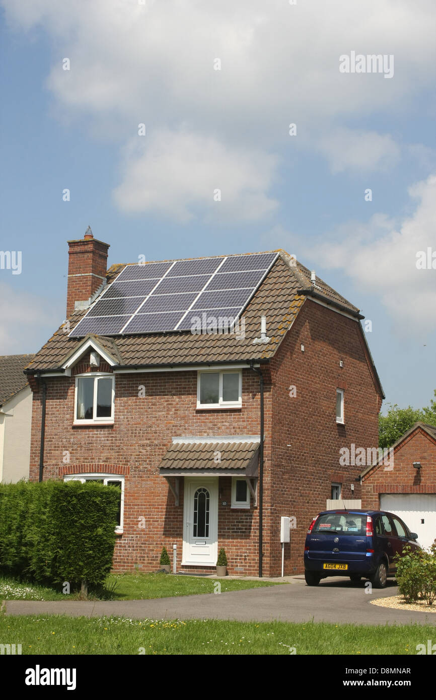 Modern generic English house with a solar panel installation on the ...