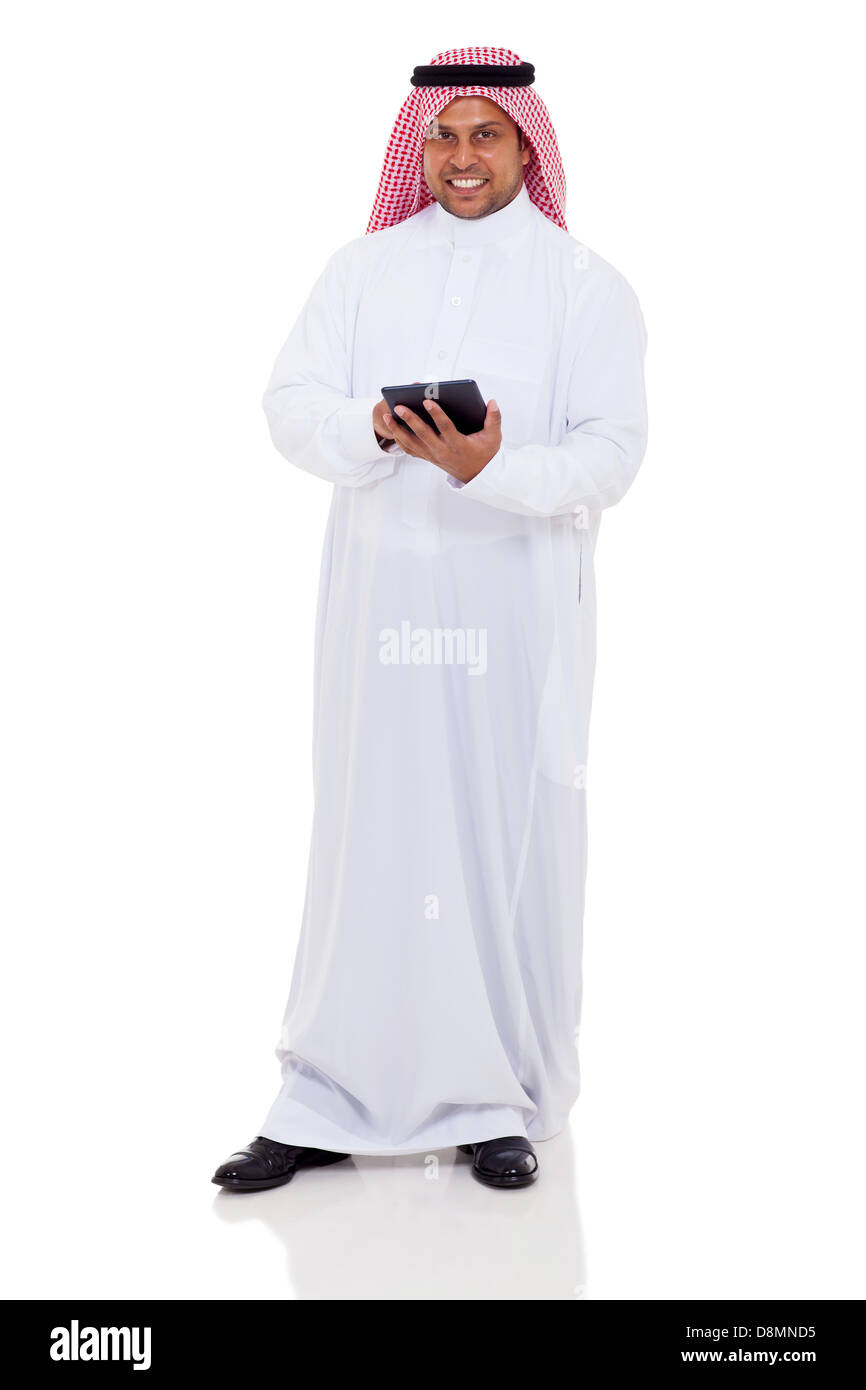 full length portrait of middle eastern man using tablet computer on ...
