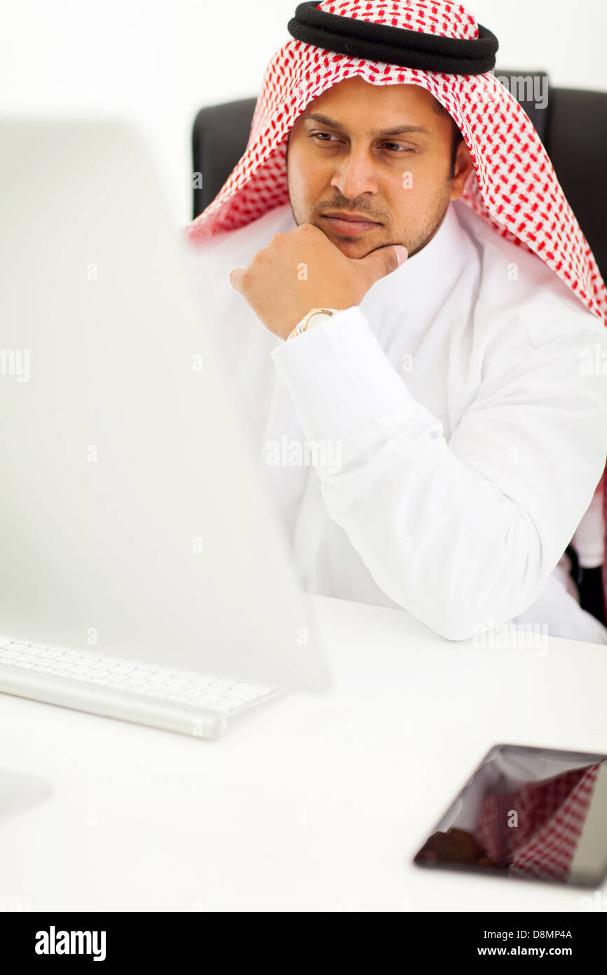 thoughtful arabian businessman looking at computer screen Stock Photo ...