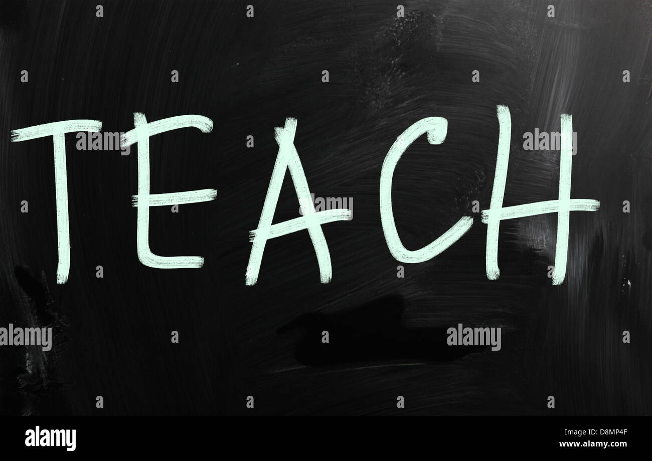 Teach handwritten with white chalk on a blackboard Stock Photo - Alamy