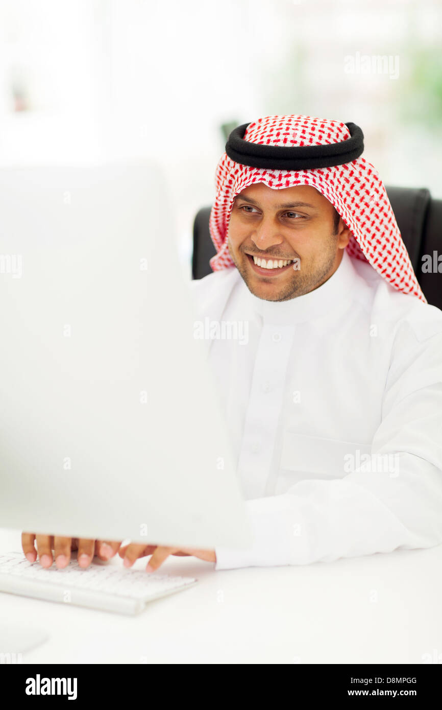 handsome arabic businessman working on computer Stock Photo - Alamy