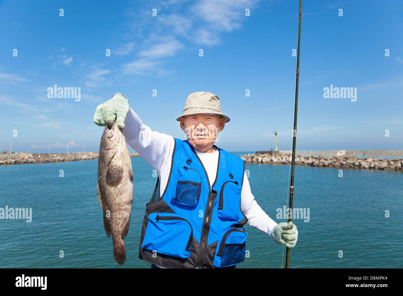 Old man holding big fish hi-res stock photography and images - Alamy