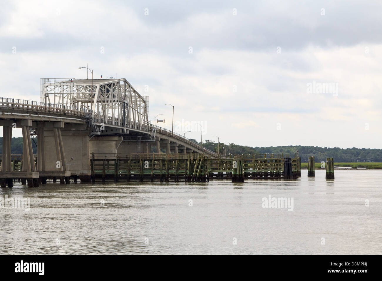 A wooden and concrete bridge for cars in the nature of the southern ...