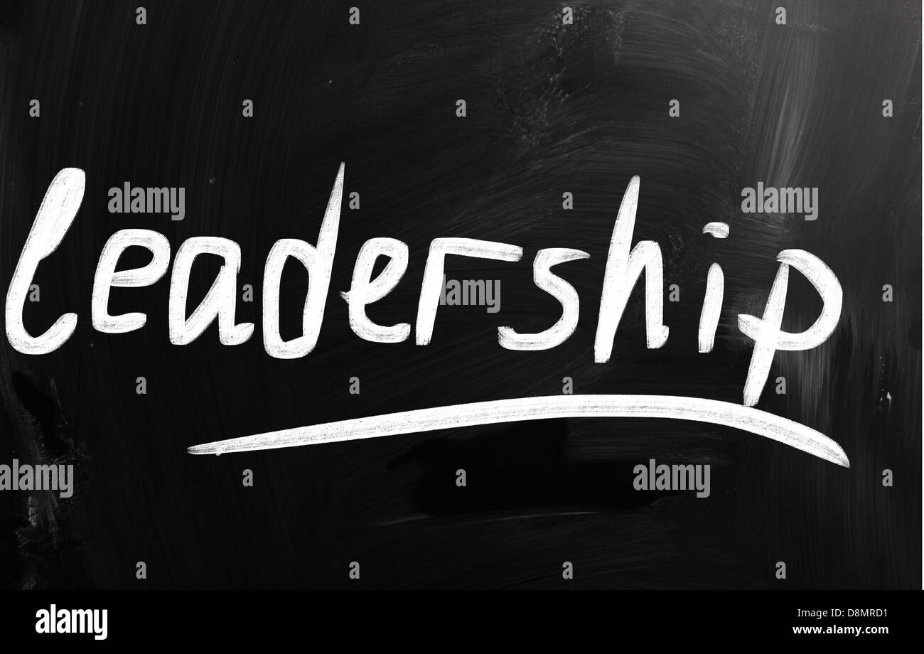 The word "Leadership" handwritten with white chalk on a blackboard ...