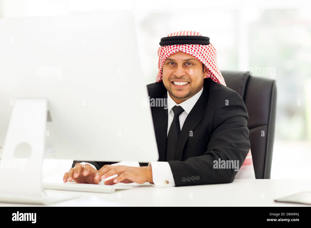 handsome middle eastern corporate worker working on his computer Stock ...
