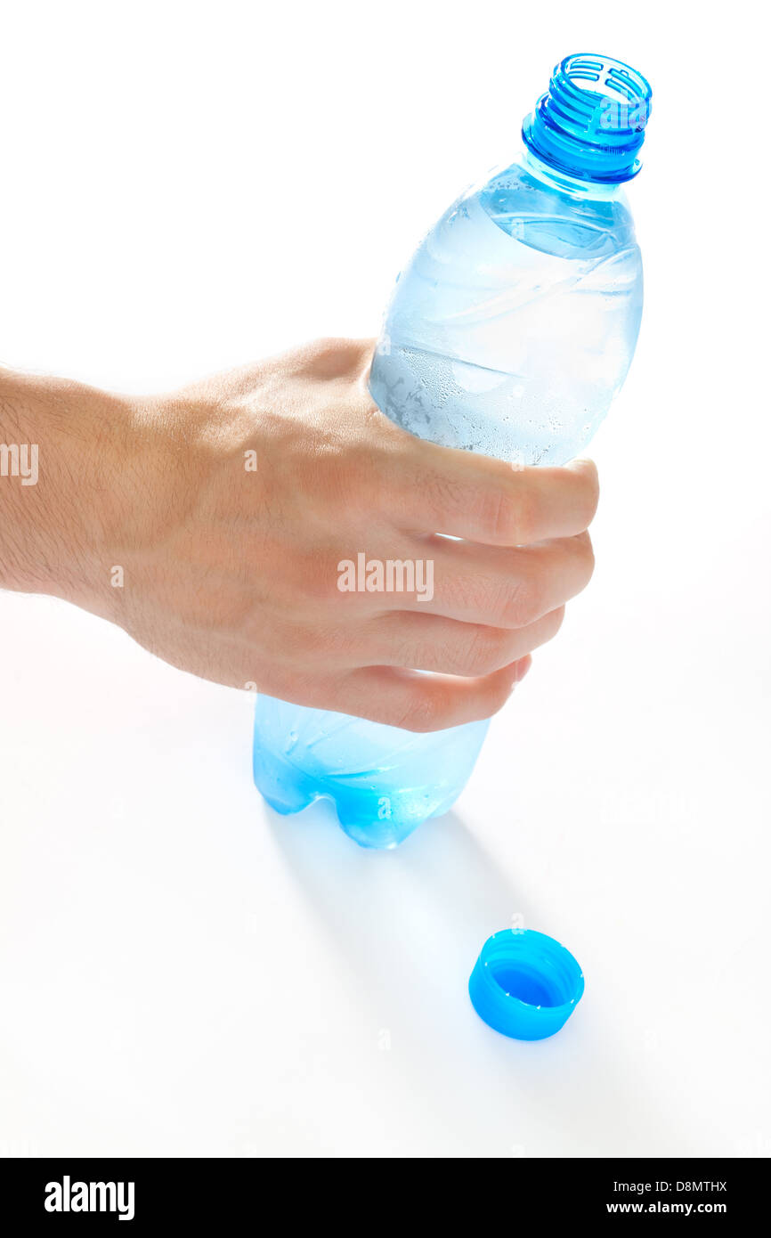 Man hand with fresh water in bottle Stock Photo - Alamy
